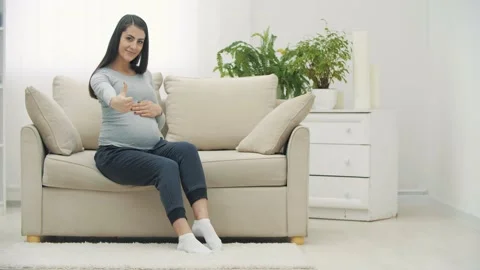 4k slowmotion video of pregnant woman si... | Stock Video | Pond5