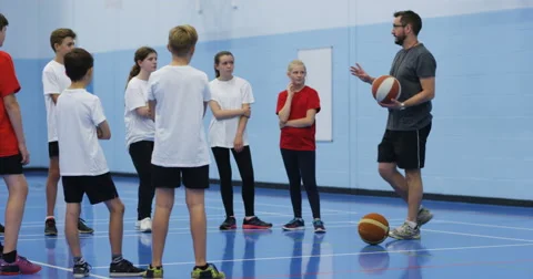 4K Sports teacher with pupils on school ... | Stock Video | Pond5