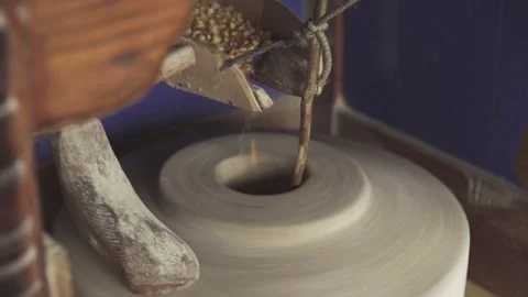 4K Stone mill grinds maize to make maize... | Stock Video | Pond5