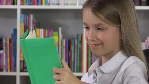 4K Student Girl, Child Face Reading Book... | Stock Video | Pond5