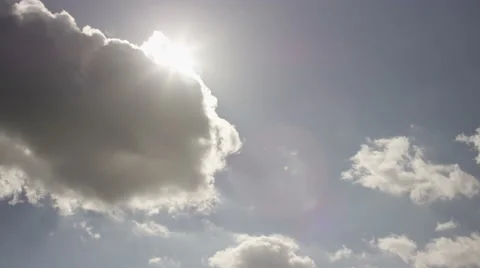 4K Sun reveals itself from behind a larg... | Stock Video | Pond5