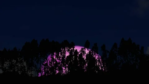 4k super pink moon rise back on silhouet... | Stock Video | Pond5