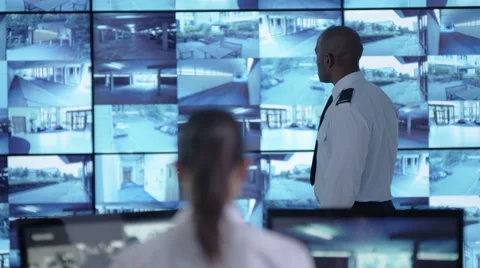 4K Surveillance team watching CCTV scree... | Stock Video | Pond5
