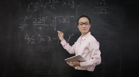 4K Teacher writing math formulas on blac... | Stock Video | Pond5