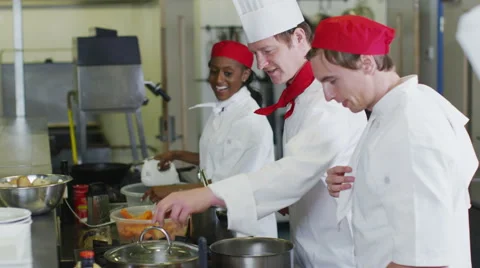 4K Team of chefs preparing food in a com... | Stock Video | Pond5