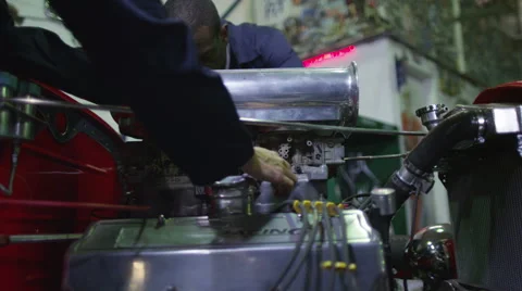 4K Team of male and female mechanics wor... | Stock Video | Pond5