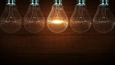 4K Thinking Light bulb . Wood background... | Stock Video | Pond5
