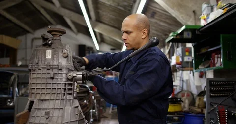 4K Tired & overworked auto mechanic yawn... | Stock Video | Pond5