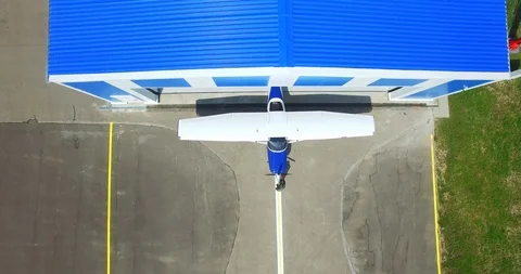 4k top view of man taking single engine ... | Stock Video | Pond5