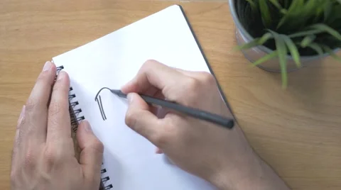 4K Top View Writing PLAN on a Notebook | Stock Video | Pond5