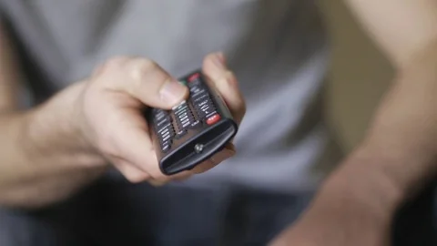 4K TV Remote Being Used Front View Close... | Stock Video | Pond5