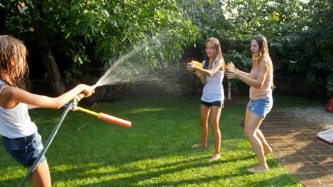 4k video of teenage girl spraying water ... | Stock Video | Pond5