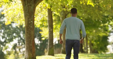 4K View from behind of happy man jumping... | Stock Video | Pond5