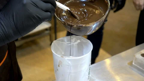 4K view of hot melted dark chocolate pou... | Stock Video | Pond5