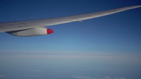 4K, View of plane wing through airplane ... | Stock Video | Pond5