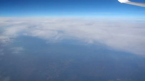 4K, View of plane wing through an airpla... | Stock Video | Pond5