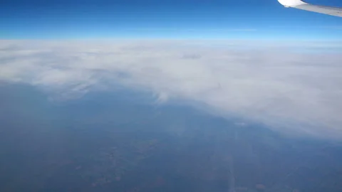 4K, View of plane wing through an airpla... | Stock Video | Pond5