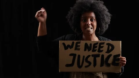 [4k] we need justice said by female blac... | Stock Video | Pond5