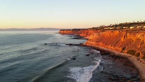 4K West Coast cliffs with water at sunse... | Stock Video | Pond5