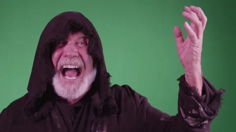 4K Wizard laughing hysterically on green... | Stock Video | Pond5