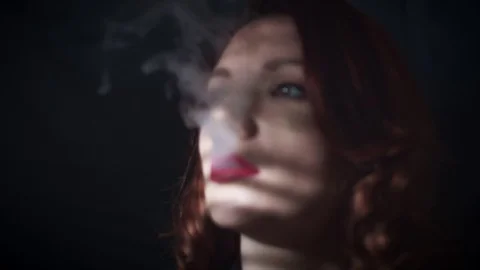 4k Woman Portrait Smoking in Reverse | Stock Video | Pond5