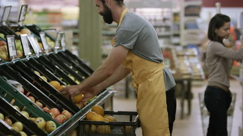 4K Worker stocking shelves in grocery st... | Stock Video | Pond5
