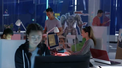 4K Young Asian computer design team coll... | Stock Video | Pond5