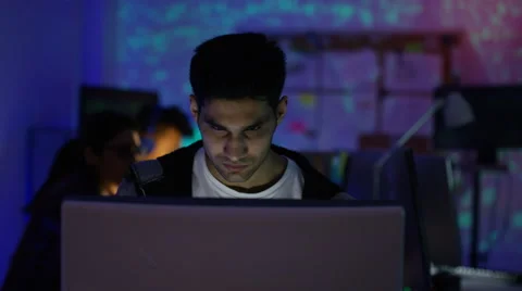 4K Young computer hacker trying to gain ... | Stock Video | Pond5