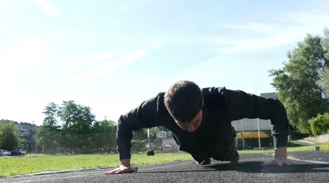 4k, young man push ups on the playground... | Stock Video | Pond5