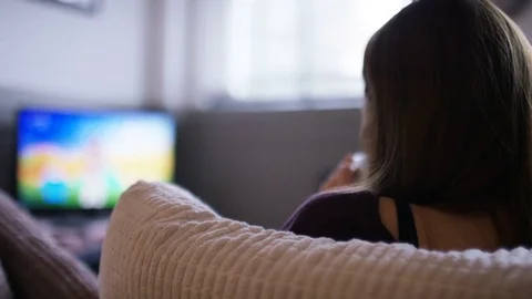 4K Young woman relaxing at home with a h... | Stock Video | Pond5