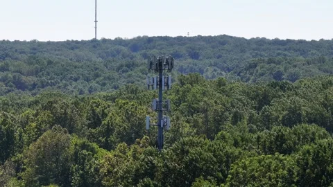 5G 4G Cell Tower among trees Tele Parall... | Stock Video | Pond5