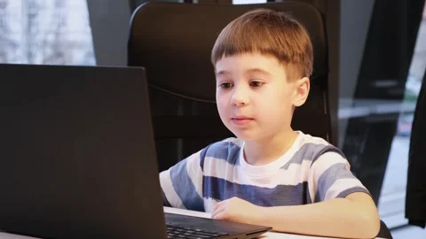 6 year child typing on the laptop. The t... | Stock Video | Pond5