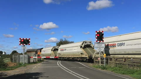 66763 GBRF train, passing an unmanned le... | Stock Video | Pond5