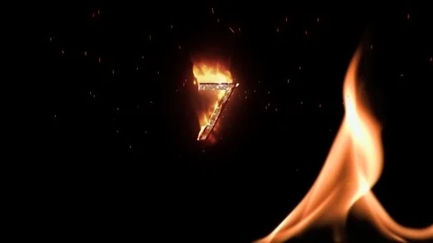 7 in flames on black background | Stock Video | Pond5