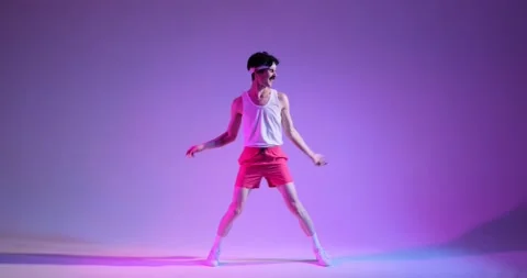 80s Man Dancing and Clapping on Purple B... | Stock Video | Pond5