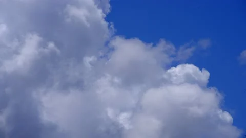 8k real time rolling clouds on blue sky | Stock Video | Pond5