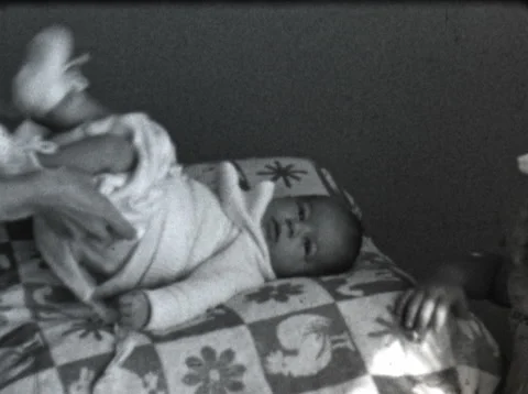 8MM - mother changing baby nappies - ear... | Stock Video | Pond5