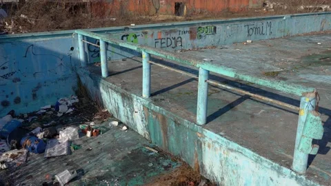 Abandoned empty outdoor swimming pool | Stock Video | Pond5