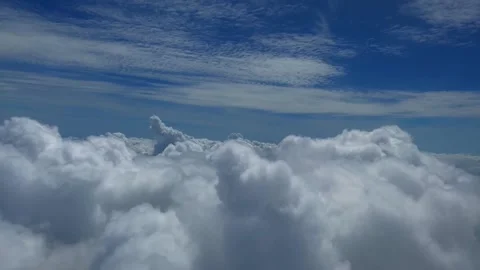 Above the world, where clouds part to re... | Stock Video | Pond5