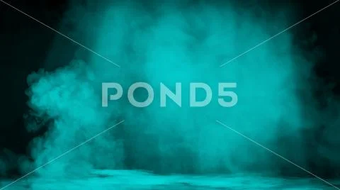 Abstract blue spotlight with smoke mist fog on a black background ...