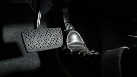 Accelerate and Brake. Foot pressing foot... | Stock Video | Pond5