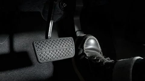 Accelerate and Brake. Foot pressing foot... | Stock Video | Pond5