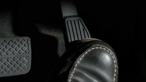 Accelerate and Brake. Foot pressing foot... | Stock Video | Pond5