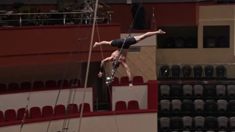 Acrobatic man flying around upside down ... | Stock Video | Pond5