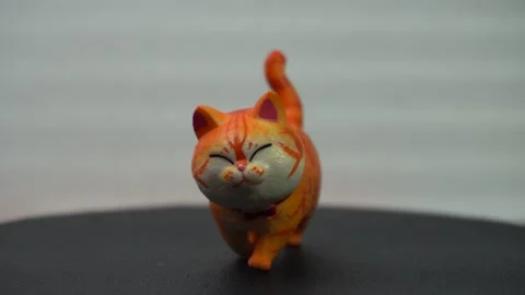action figure cats orange color on show ... | Stock Video | Pond5