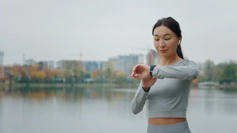 Active Asian female athlete using a smar... | Stock Video | Pond5