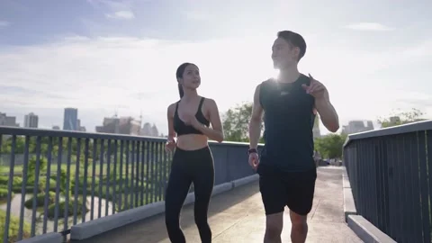 Active asian young couple enjoy jogging ... | Stock Video | Pond5