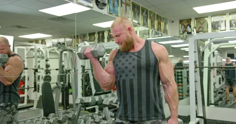 Active bodybuilder young man lifting hea... | Stock Video | Pond5