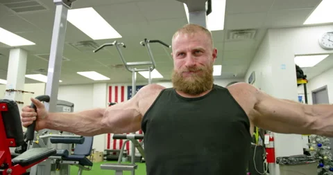 Active bodybuilder young man lifting hea... | Stock Video | Pond5