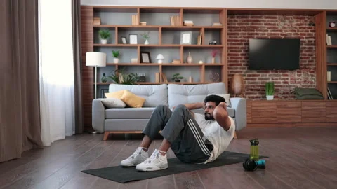 Active indian man training abs with body... | Stock Video | Pond5